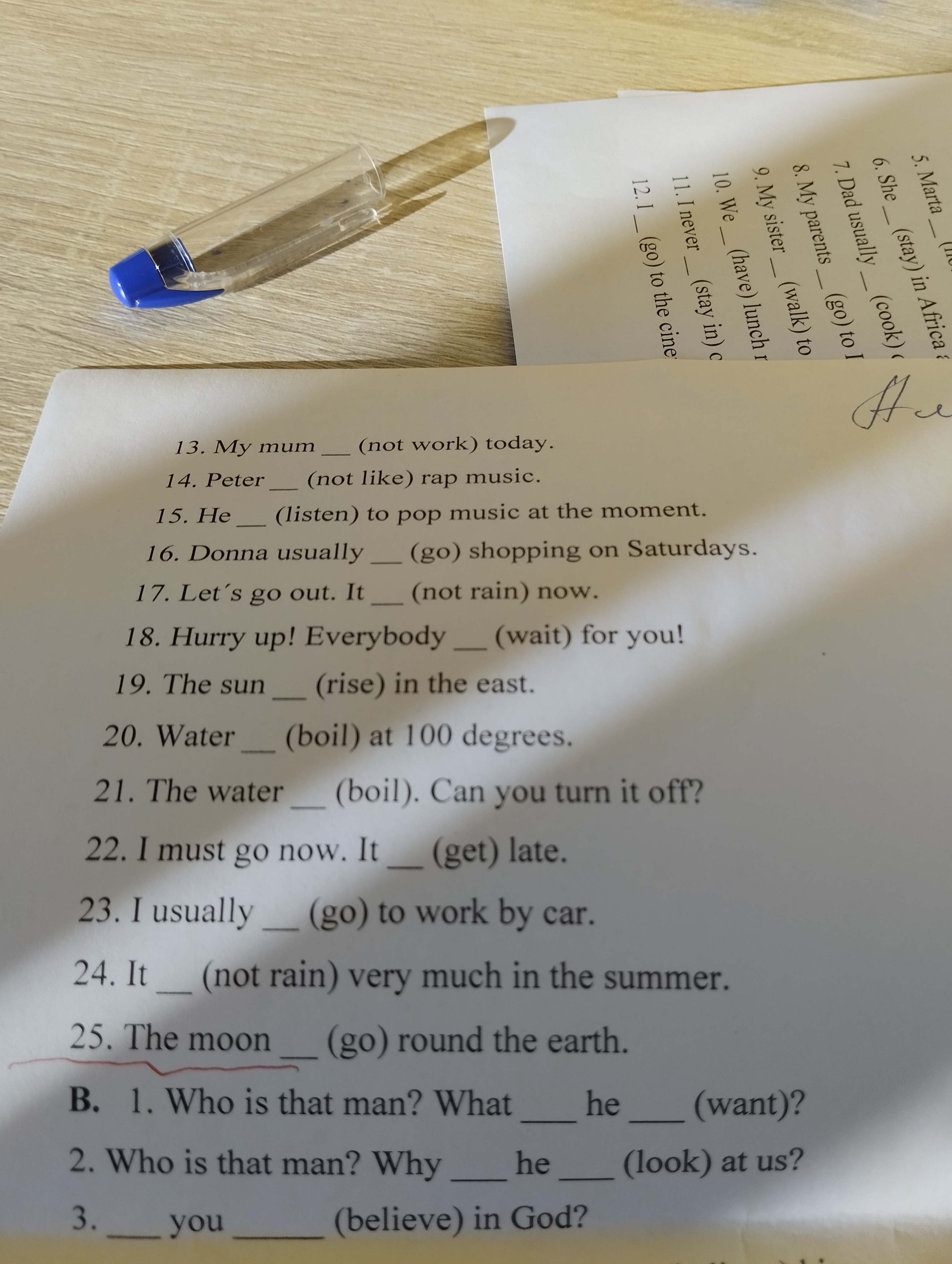 2. Who is that man? Why he (look) at us?